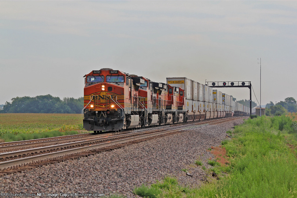 BNSF 5212 leads a Wb stack train past the atsf lights.